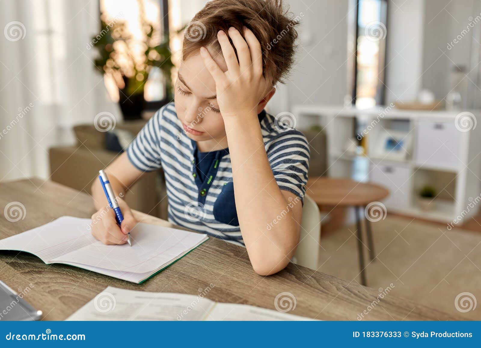Student Boy with Book Writing To Notebook at Home Stock Image - Image ...