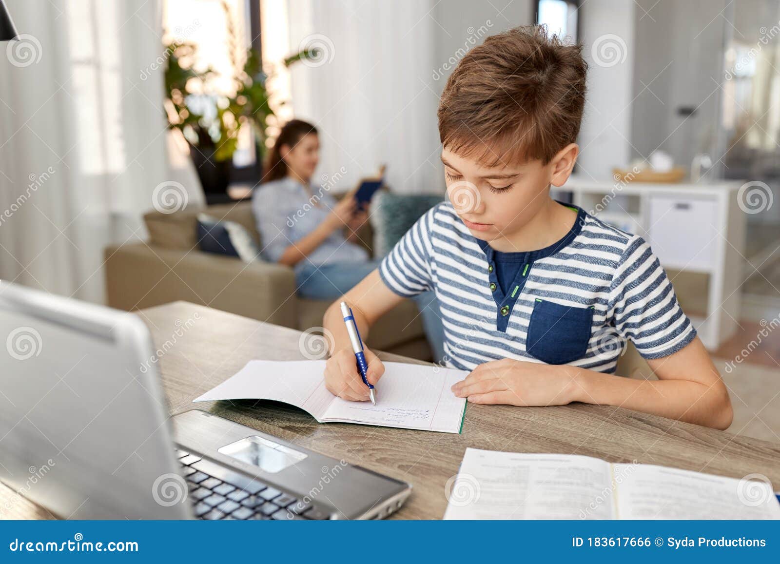 Student Boy with Book Writing To Notebook at Home Stock Photo - Image ...