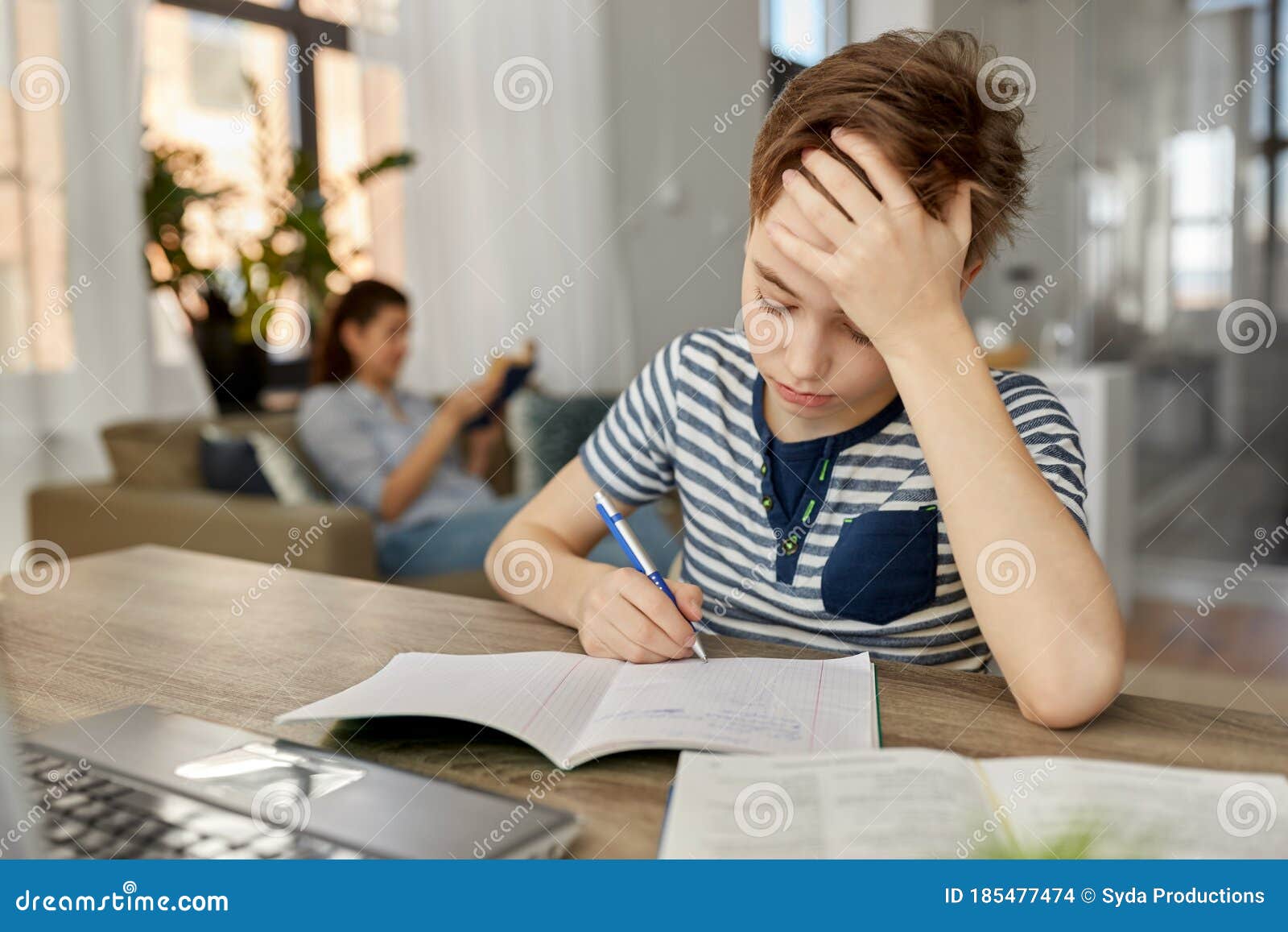 Student Boy with Book Writing To Notebook at Home Stock Photo - Image ...