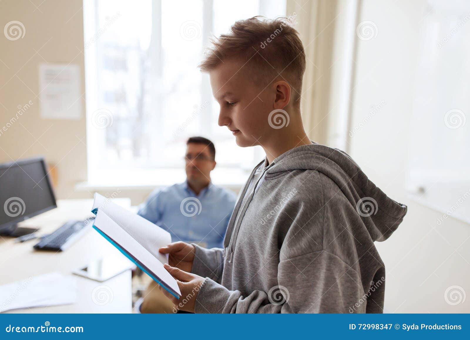 Student Boy with Notebook and Teacher at School Stock Image - Image of ...