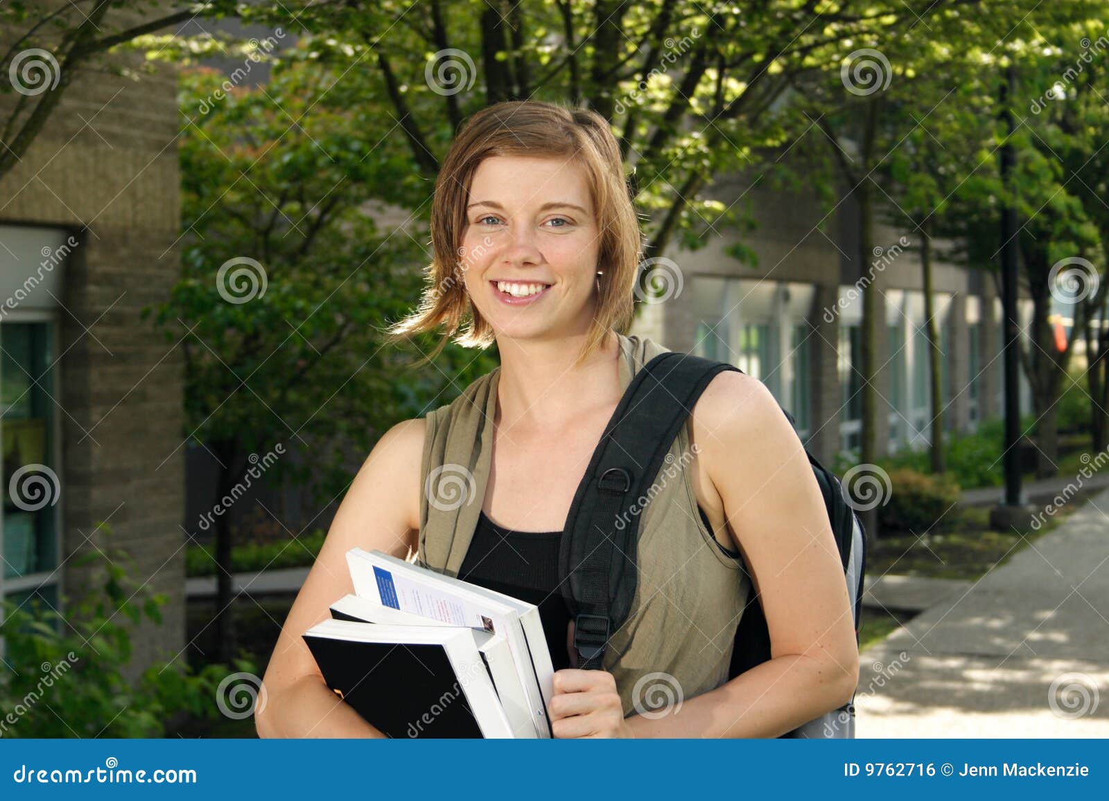 Student Carrying Books on Campus Stock Photo - Image of female, happy ...
