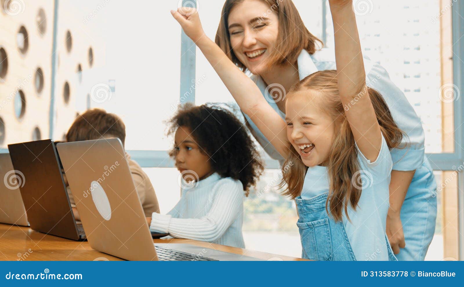 Student Celebrate Successful Project while Teacher Looking at Screen ...