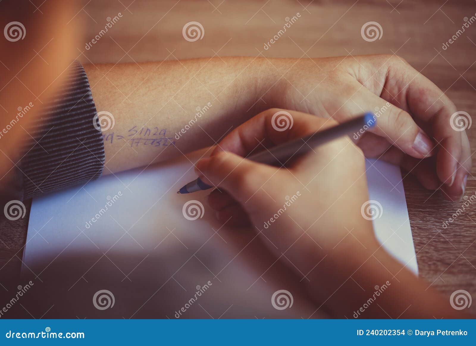 Student Cheating during Exam in University, Reading Cheat Sheet with ...