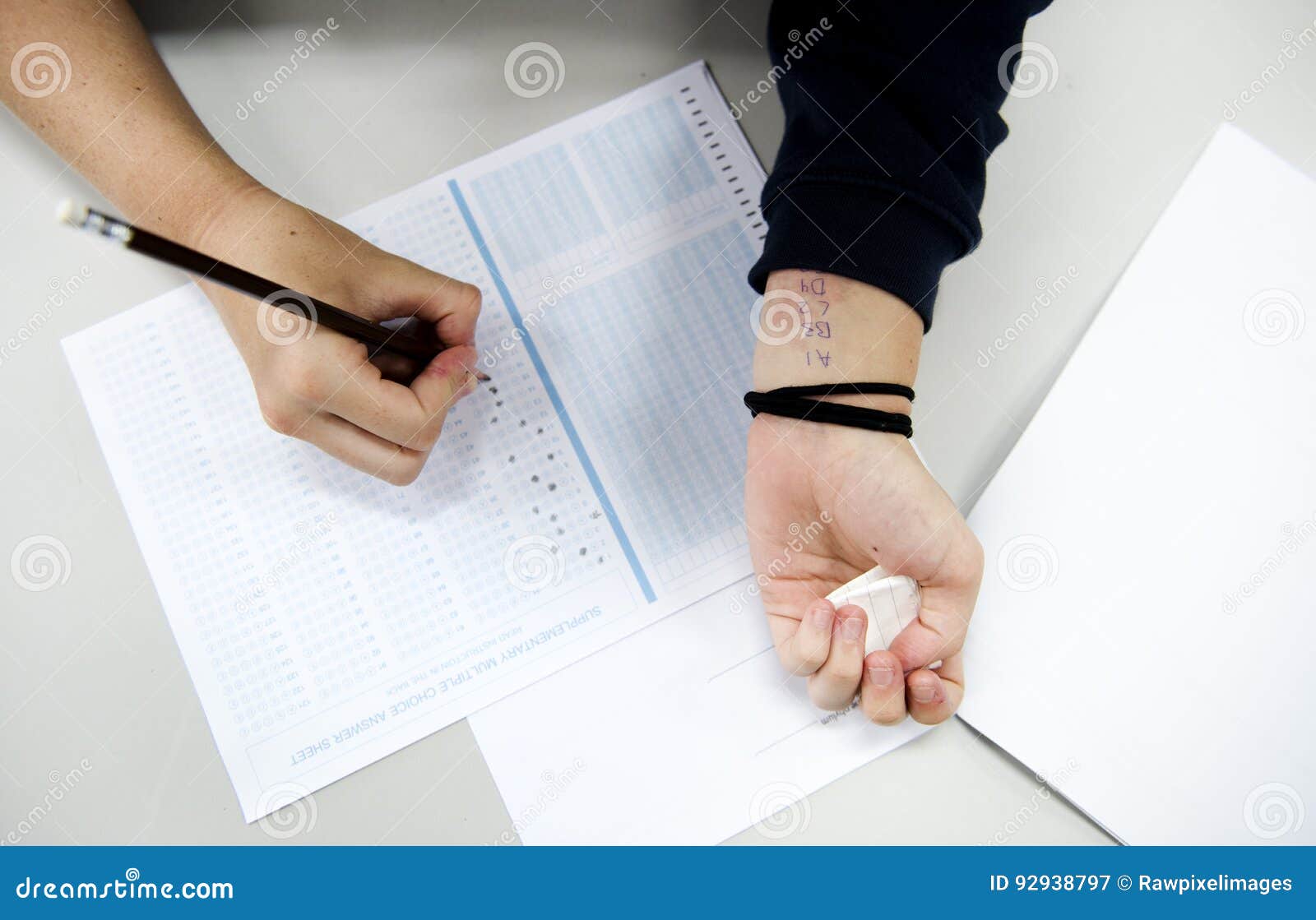 Student Is Cheating During Exam With Cheat Sheet With Formula Royalty ...