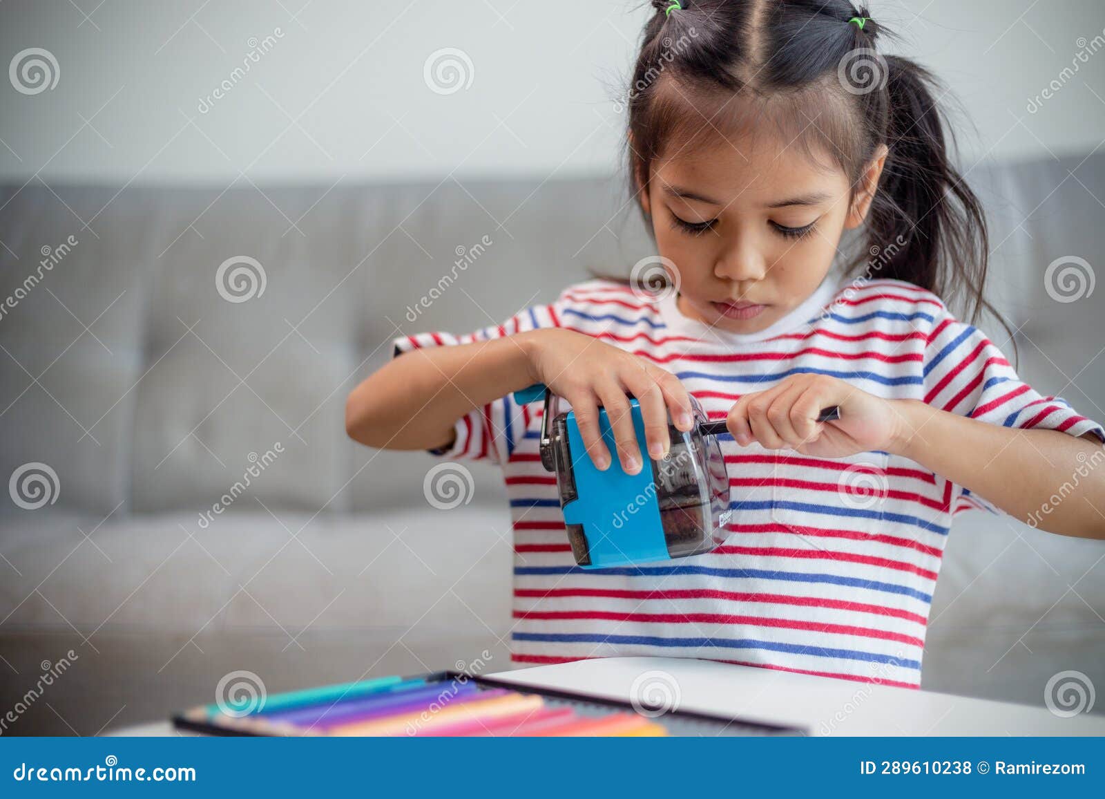 Student Child Girl Using Pencil Sharpener while Doing Homework ...