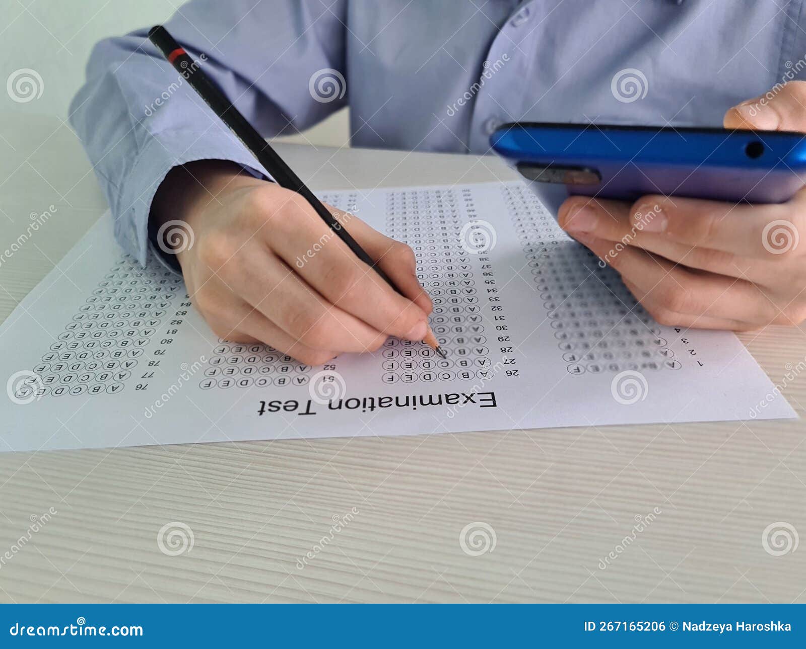 Student Child Holding Smartphone during Control Exam Test at School and ...