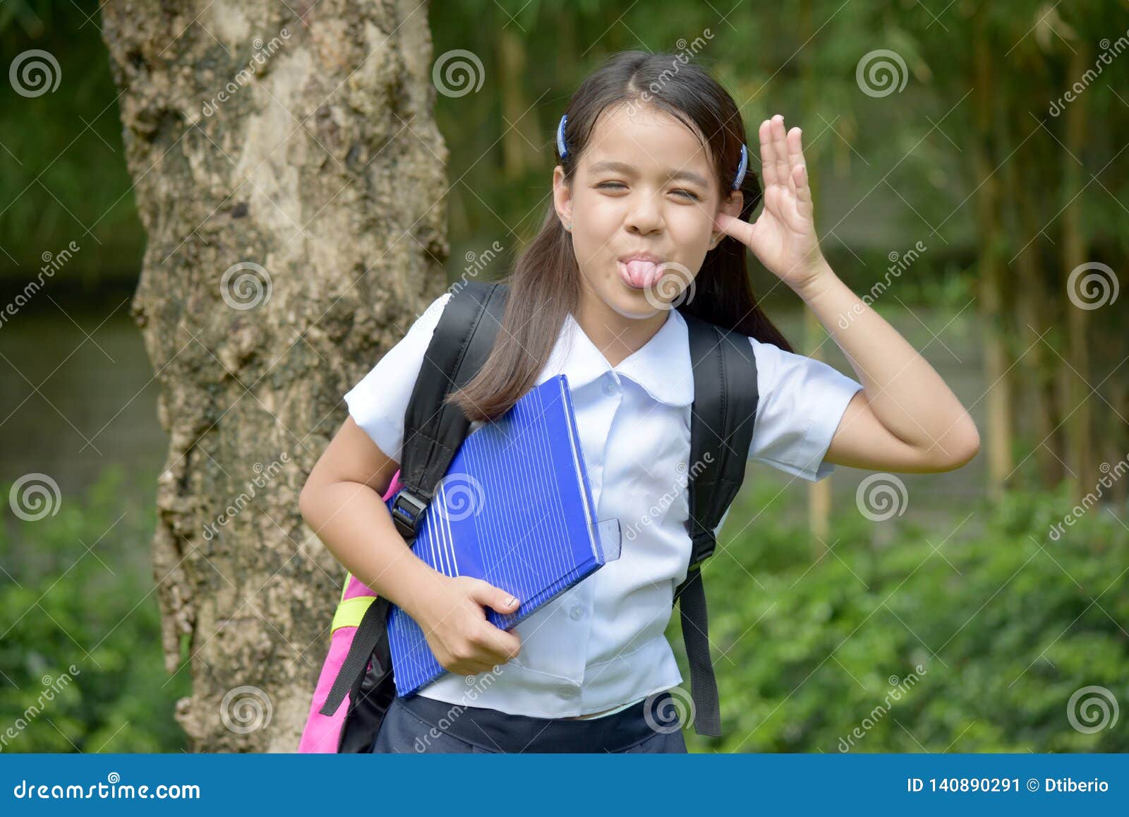 Student Child Making Funny Faces with Notebooks Stock Image - Image of ...