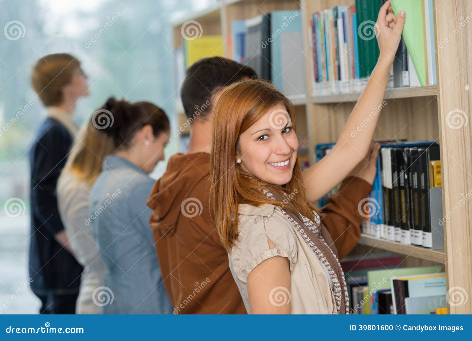 Student Choosing Book from Bookshelf in Library Stock Photo - Image of ...
