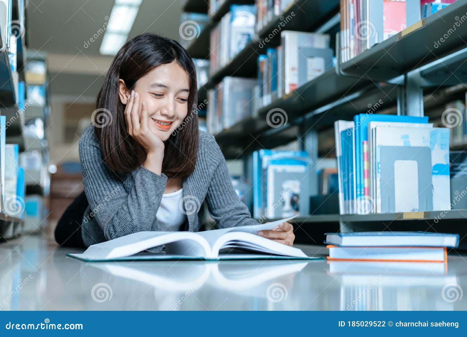 Student College Opening and Reading a Book at Library Stock Photo ...