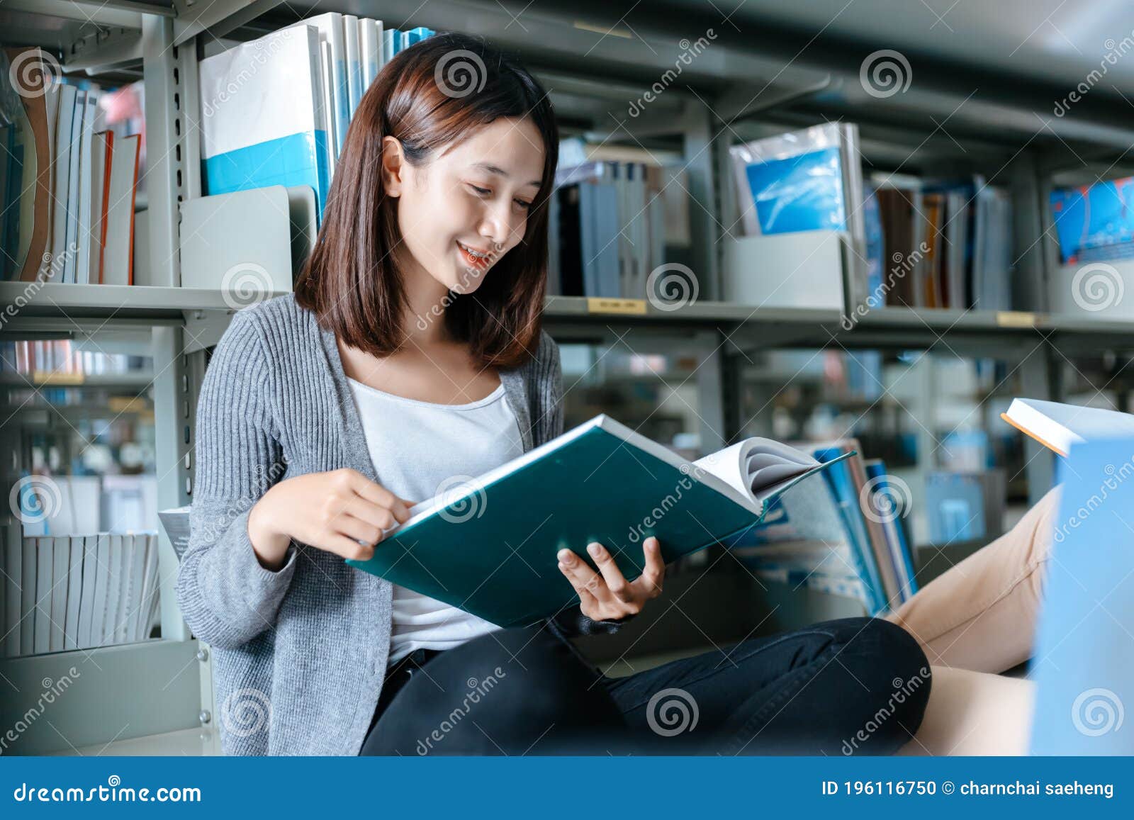 Student College Opening and Reading a Book at Library Stock Photo ...