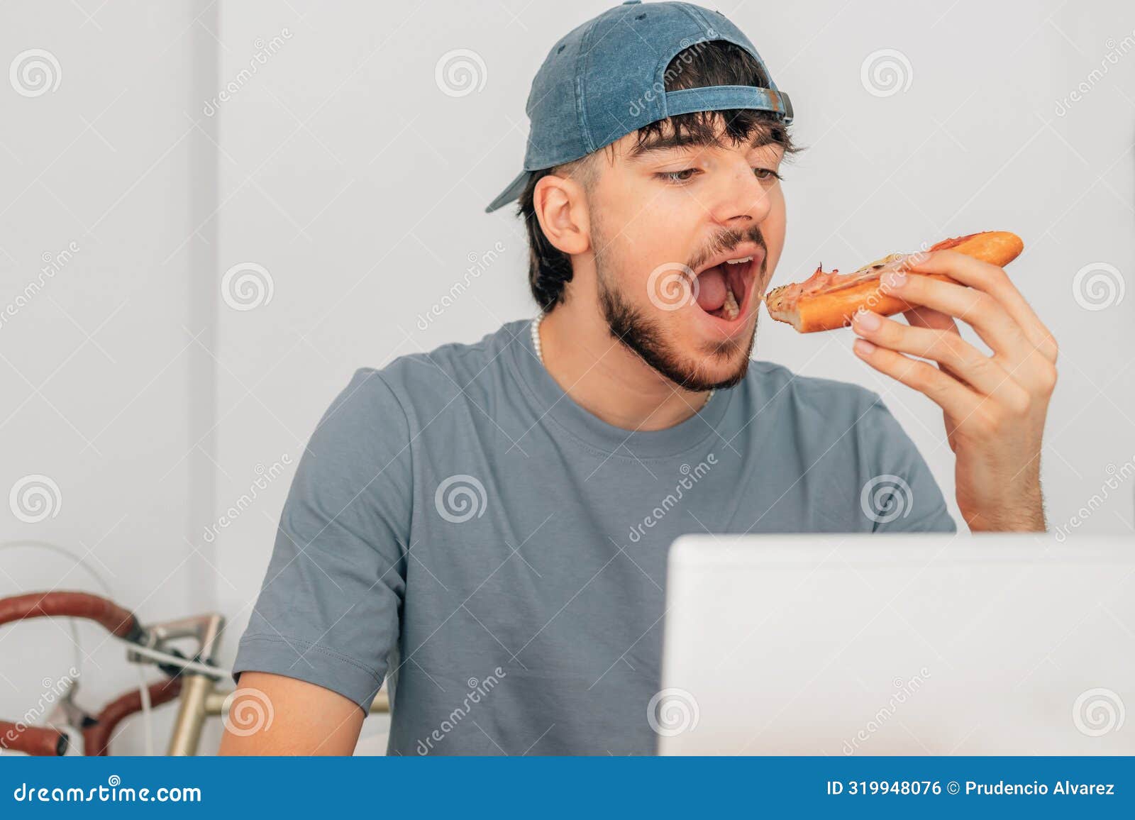 Student with Computer at Desk Eating Pizza Stock Photo - Image of ...