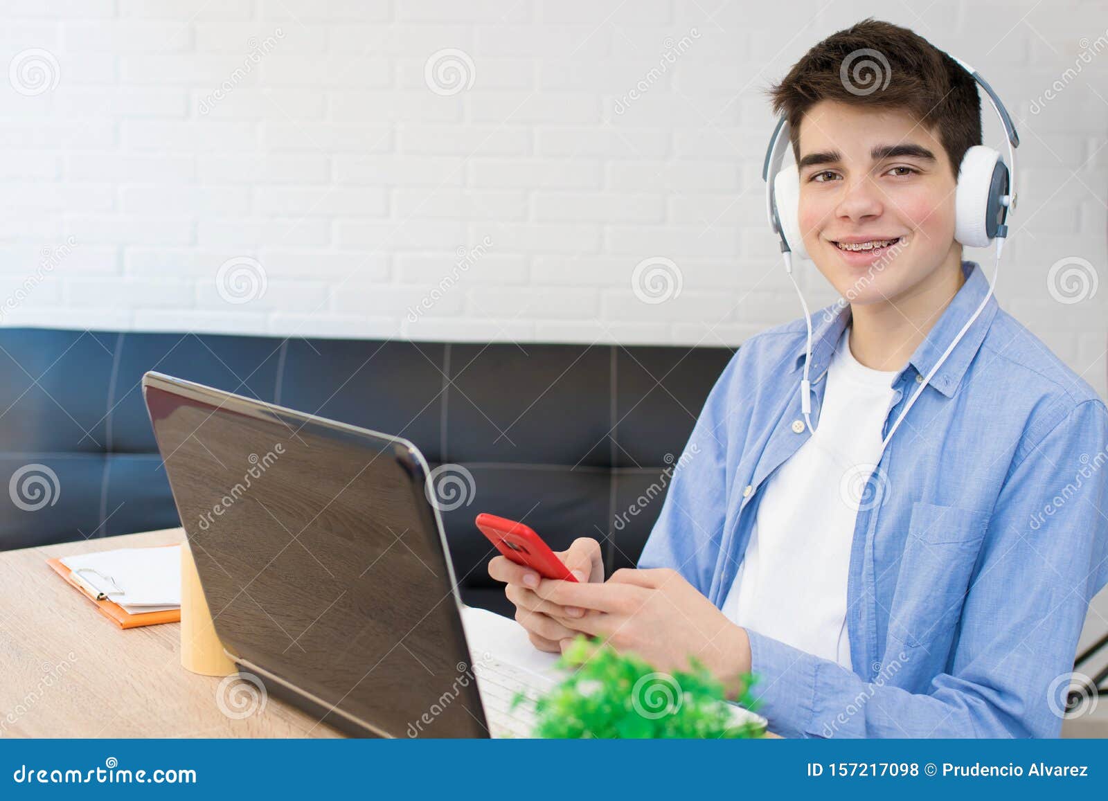 Student with computer stock photo. Image of cellphone - 157217098