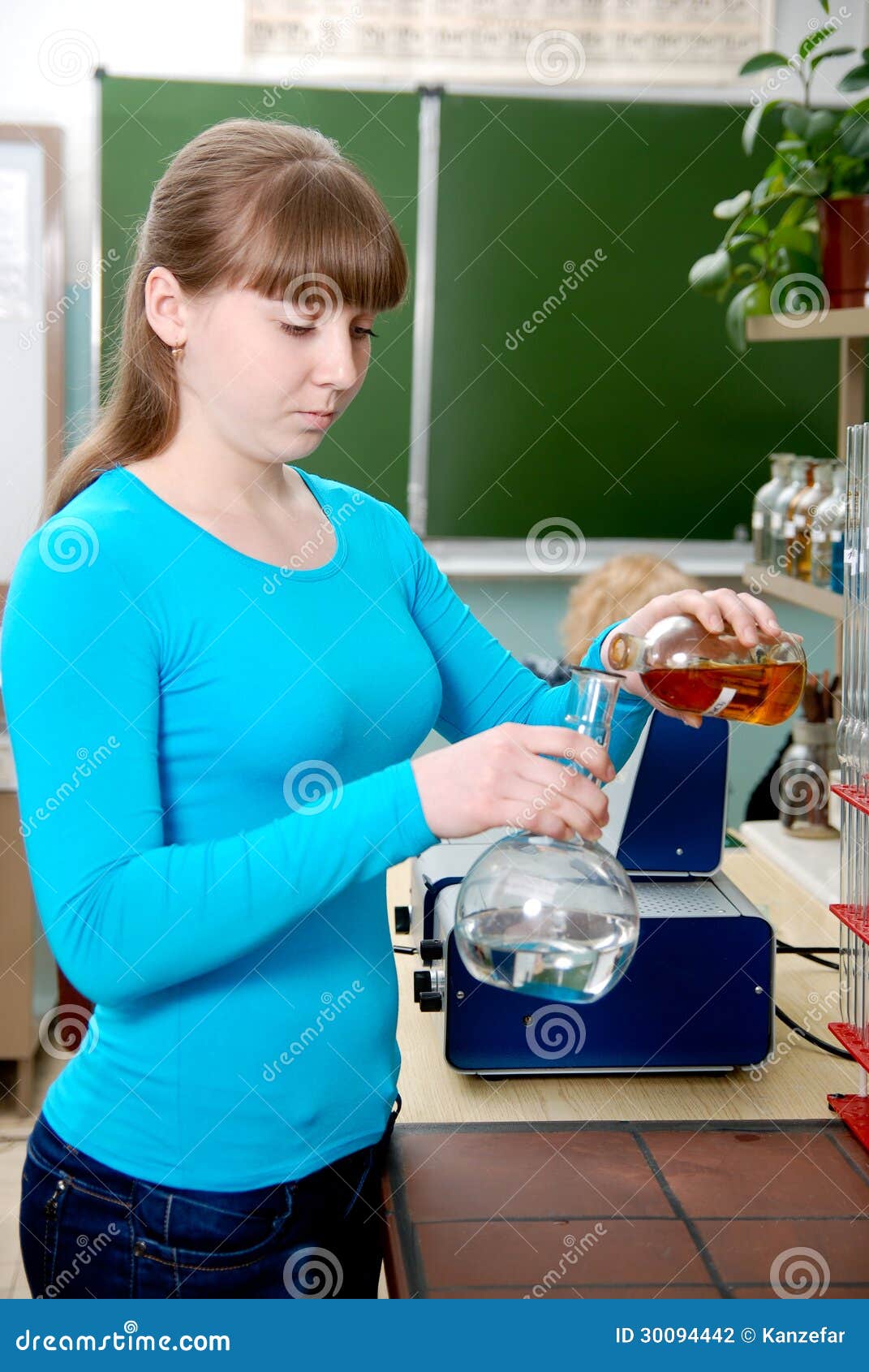 A Student Conducts an Experiment in Chemistry Lab Stock Photo - Image ...