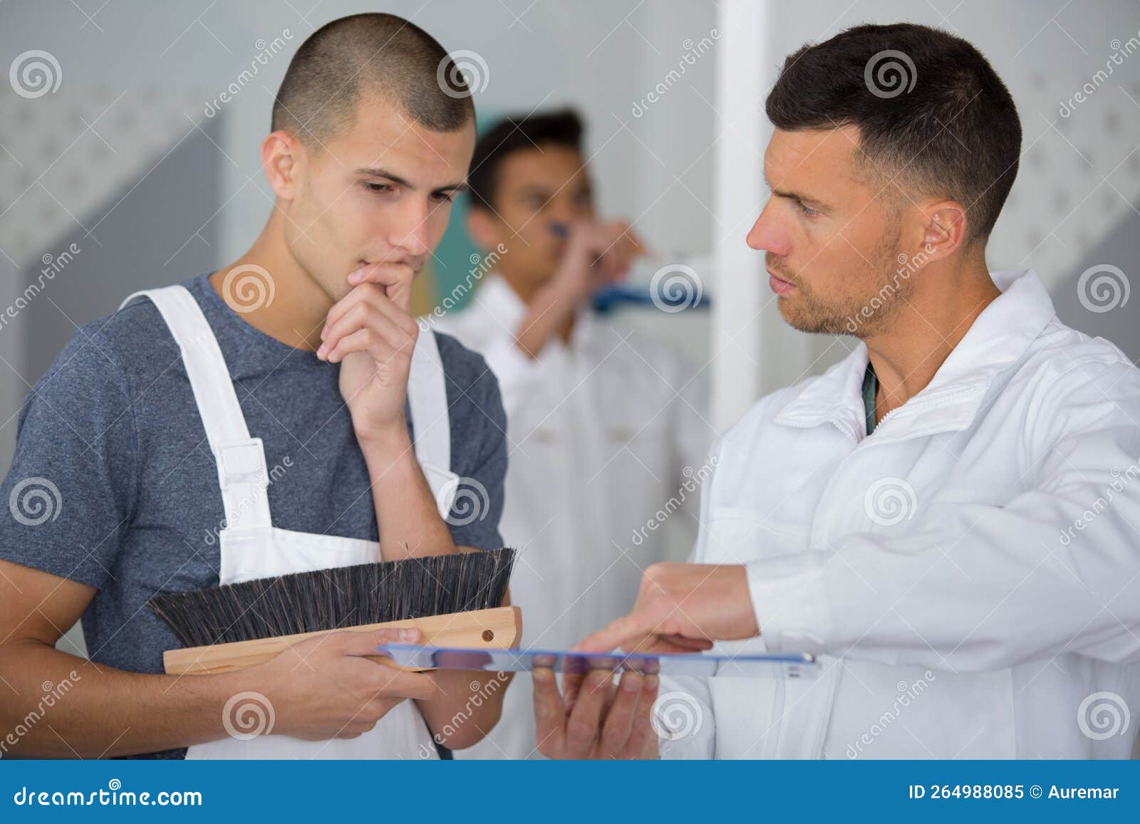 Student Decorator Holding Wallpapering Brush Talking To Supervisor ...