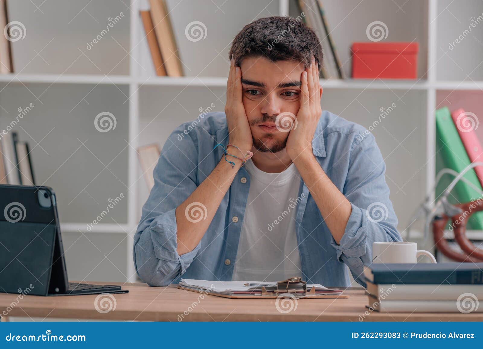 Young Man at Desk Studying Overwhelmed Stock Image - Image of ...
