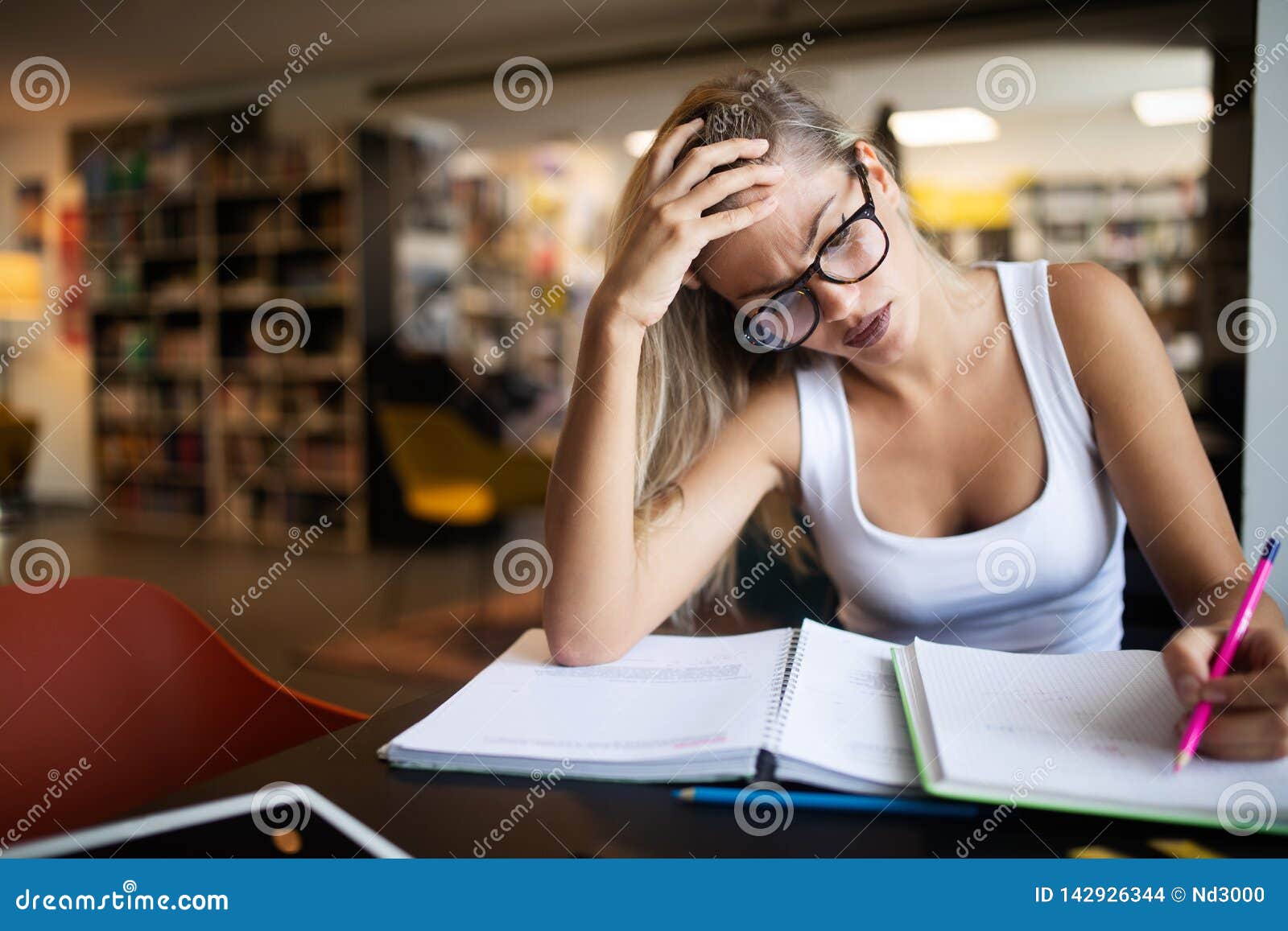Student with Desperate Expression Looking at Her Books Stock Photo ...