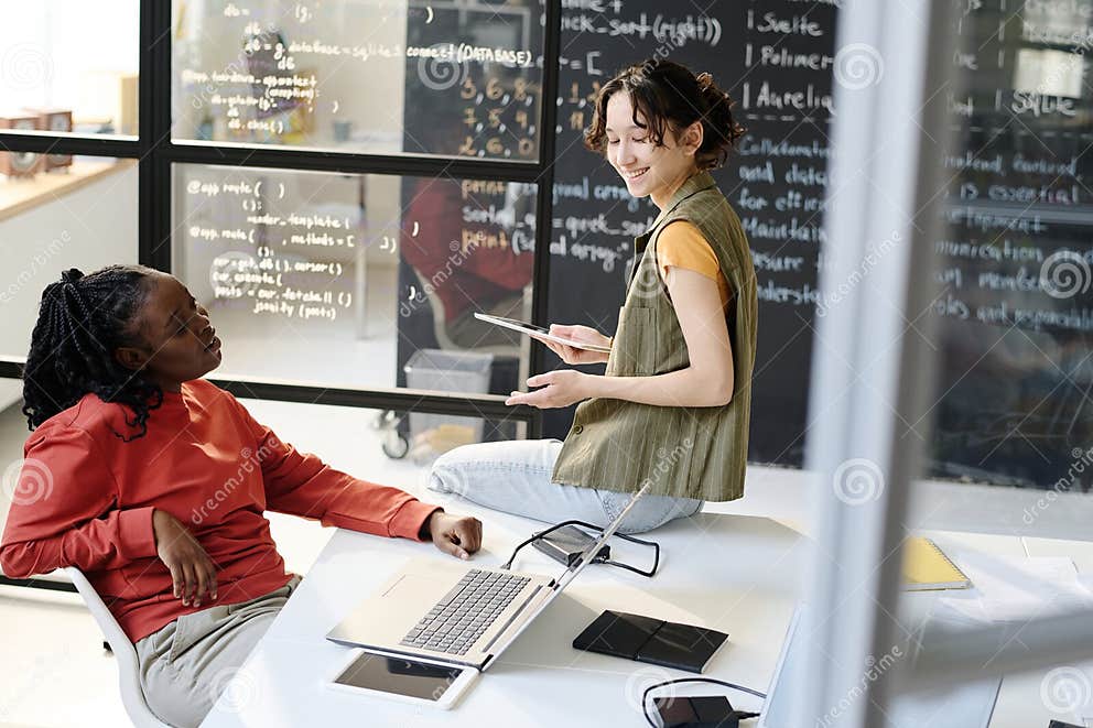 Student Discussing Material with Tutor in the Classroom Stock Photo ...