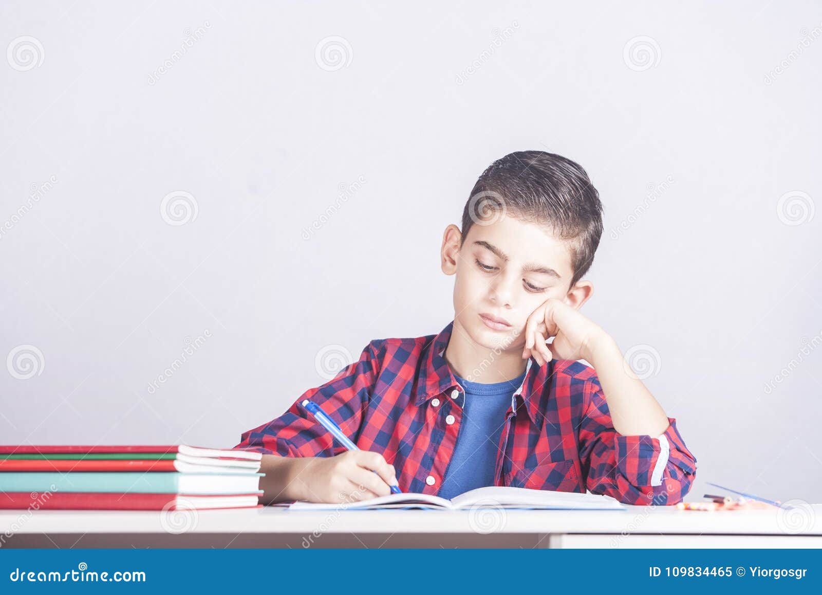 Student doing his homework stock image. Image of portrait - 109834465