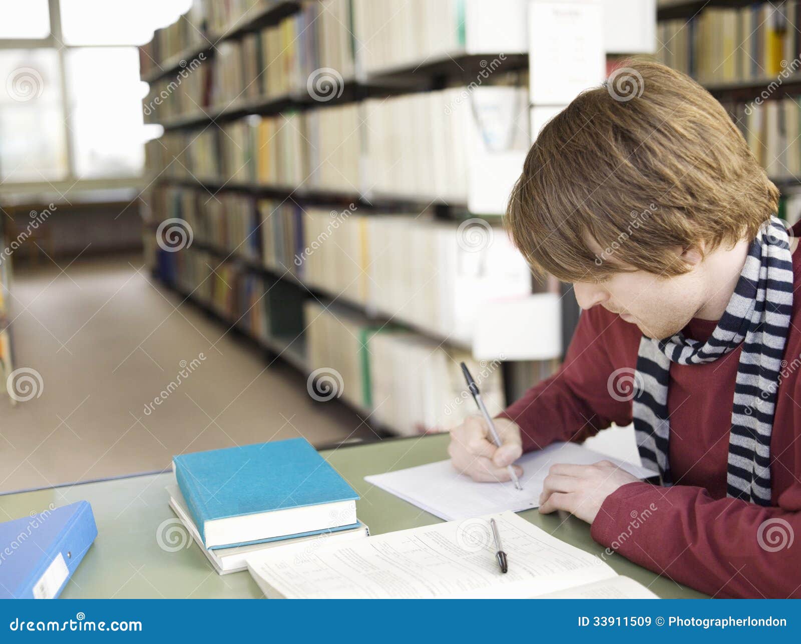 Student Doing Homework in Library Stock Image - Image of book, indoors ...