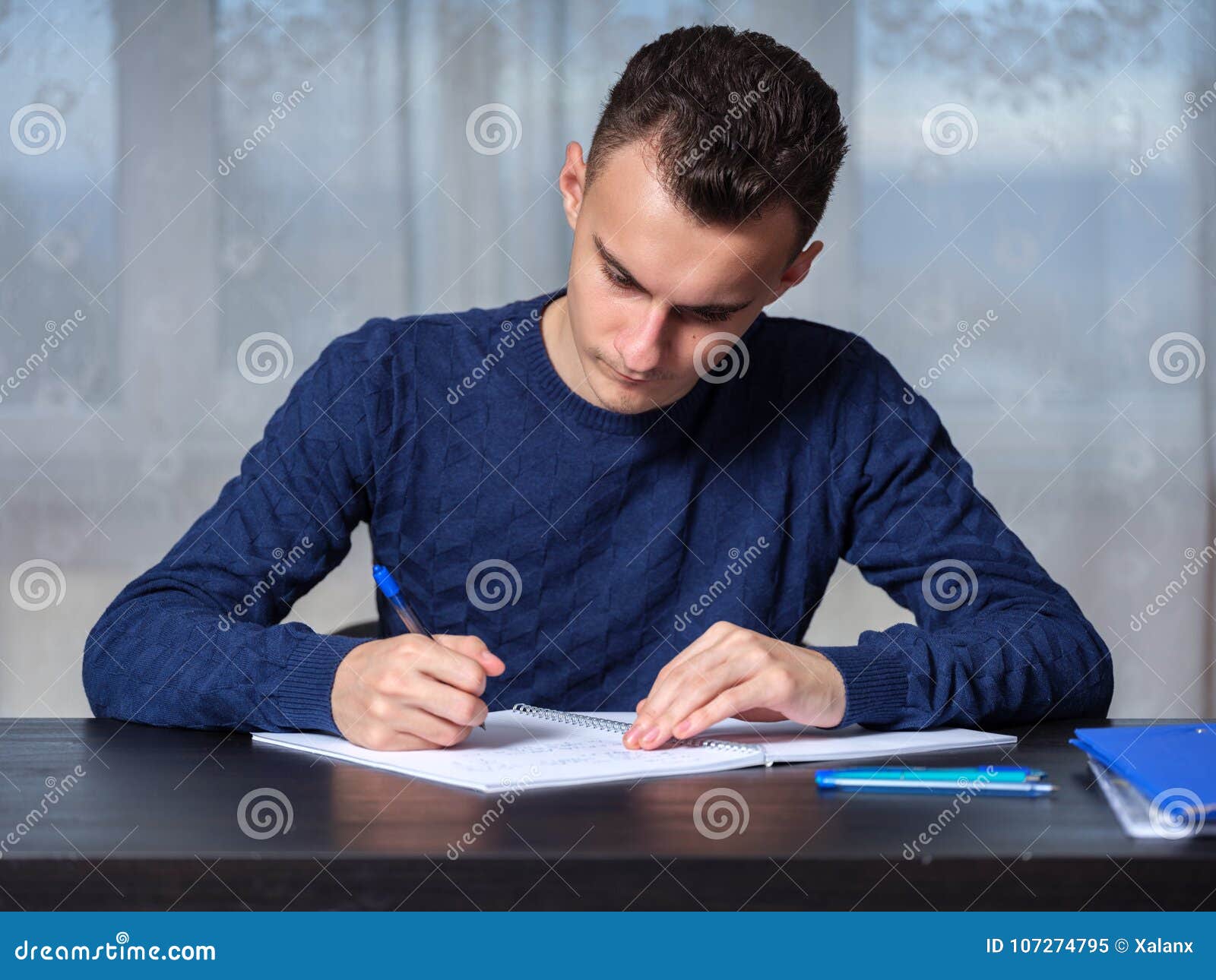 Student doing homework stock image. Image of learning - 107274795