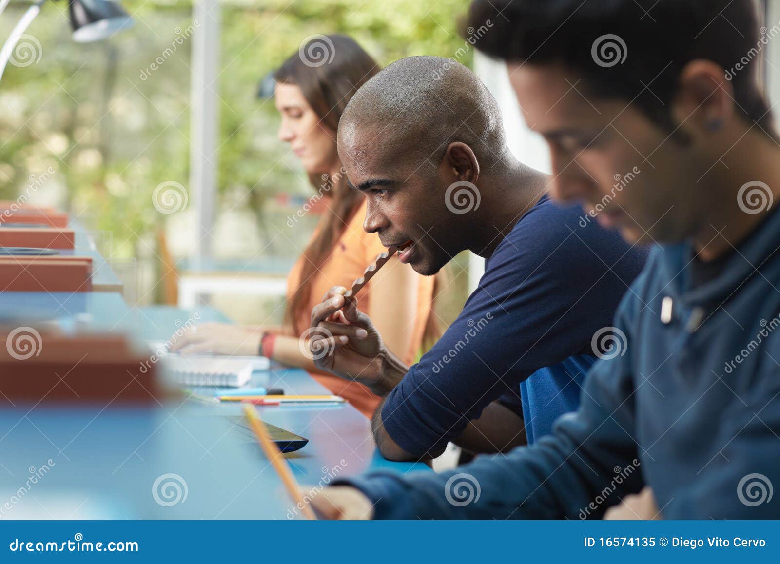 Student Eating Chocolate Bar in Library Stock Image - Image of desk ...