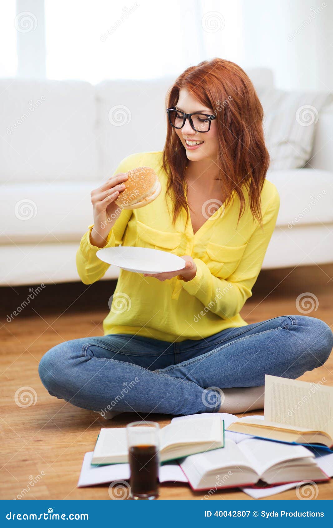 Student Eating Hamburger and Doing Homework Stock Image - Image of ...