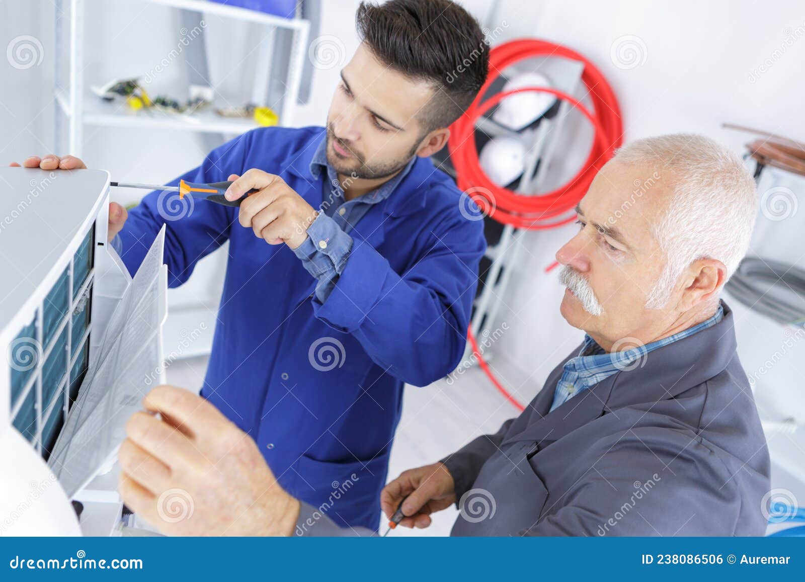 Student in Electrical Engineering Course Training with Teacher Stock ...