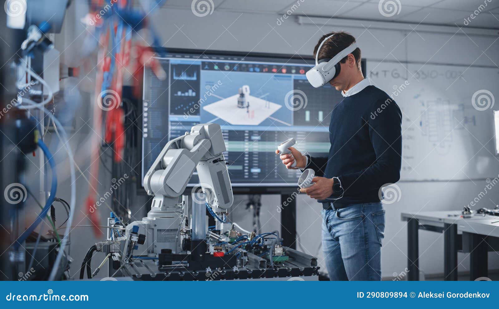 Student Engineer Wearing Virtual Reality Headset Holding Controllers ...