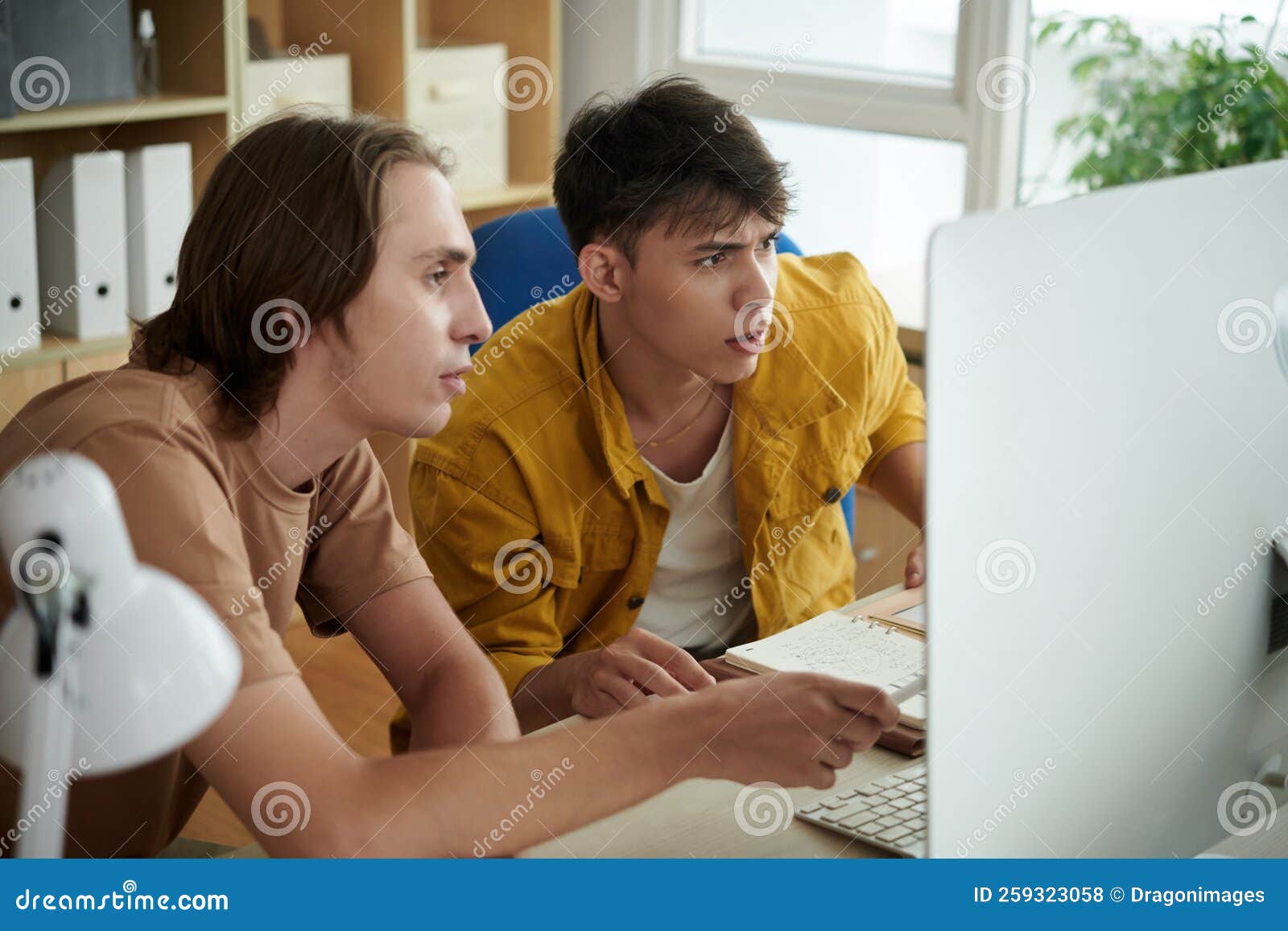 Student Explaining Topic To Friend Stock Photo - Image of screen ...