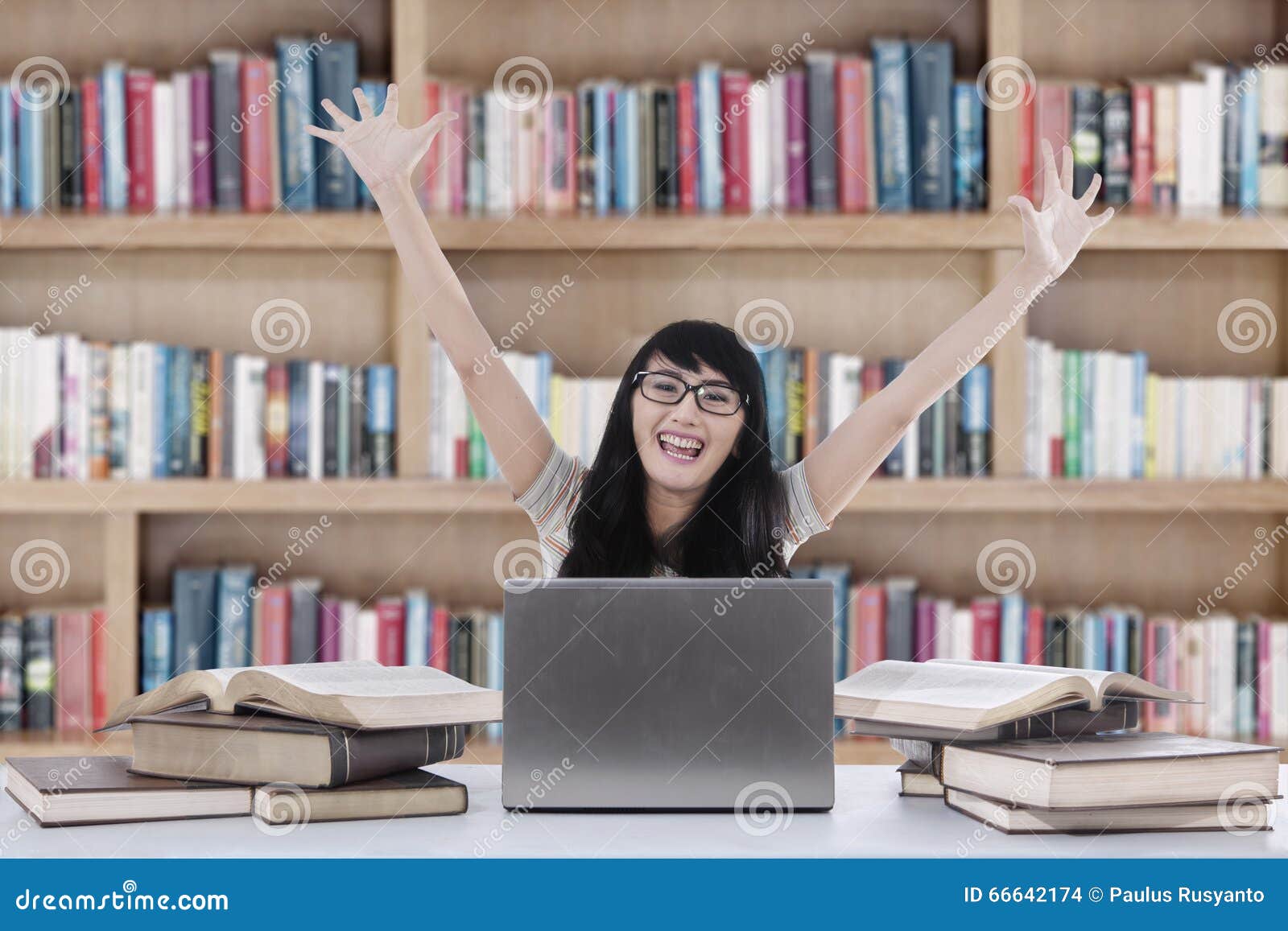 Student Expressing Happiness in the Library Stock Photo - Image of ...