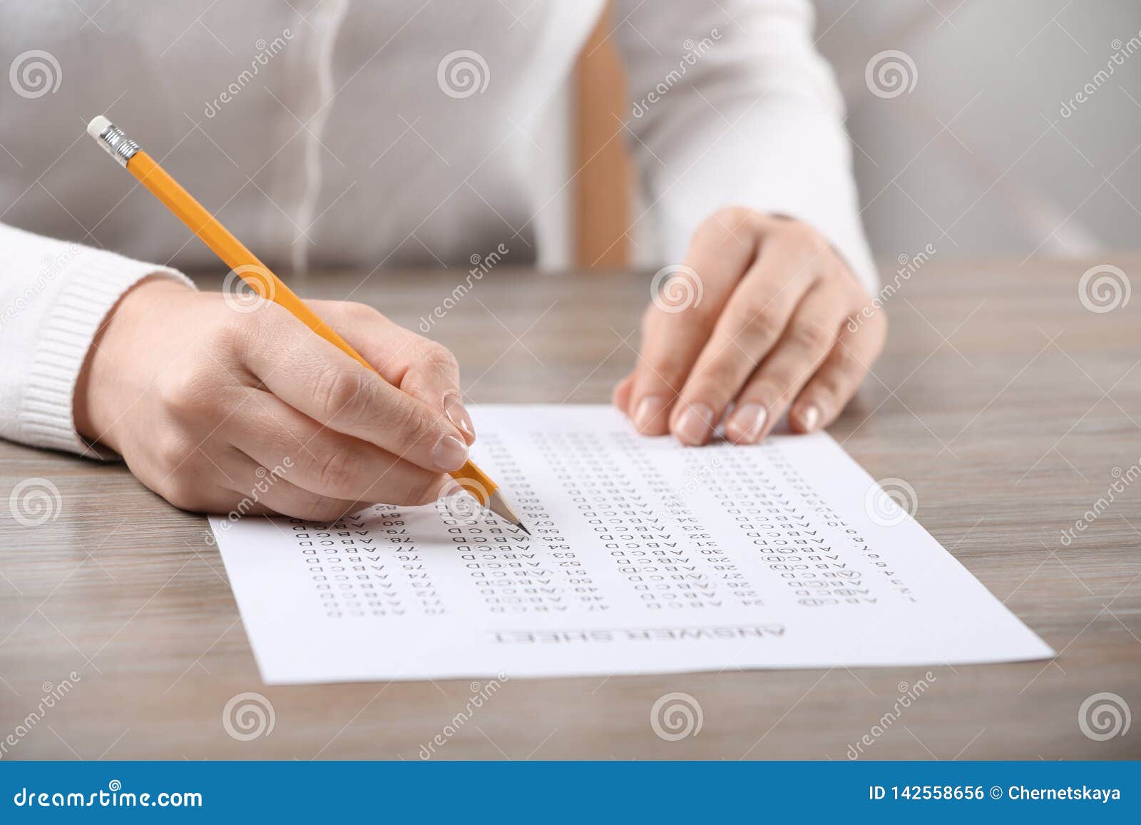 Student Filling Answer Sheet at Table Stock Photo - Image of lesson ...