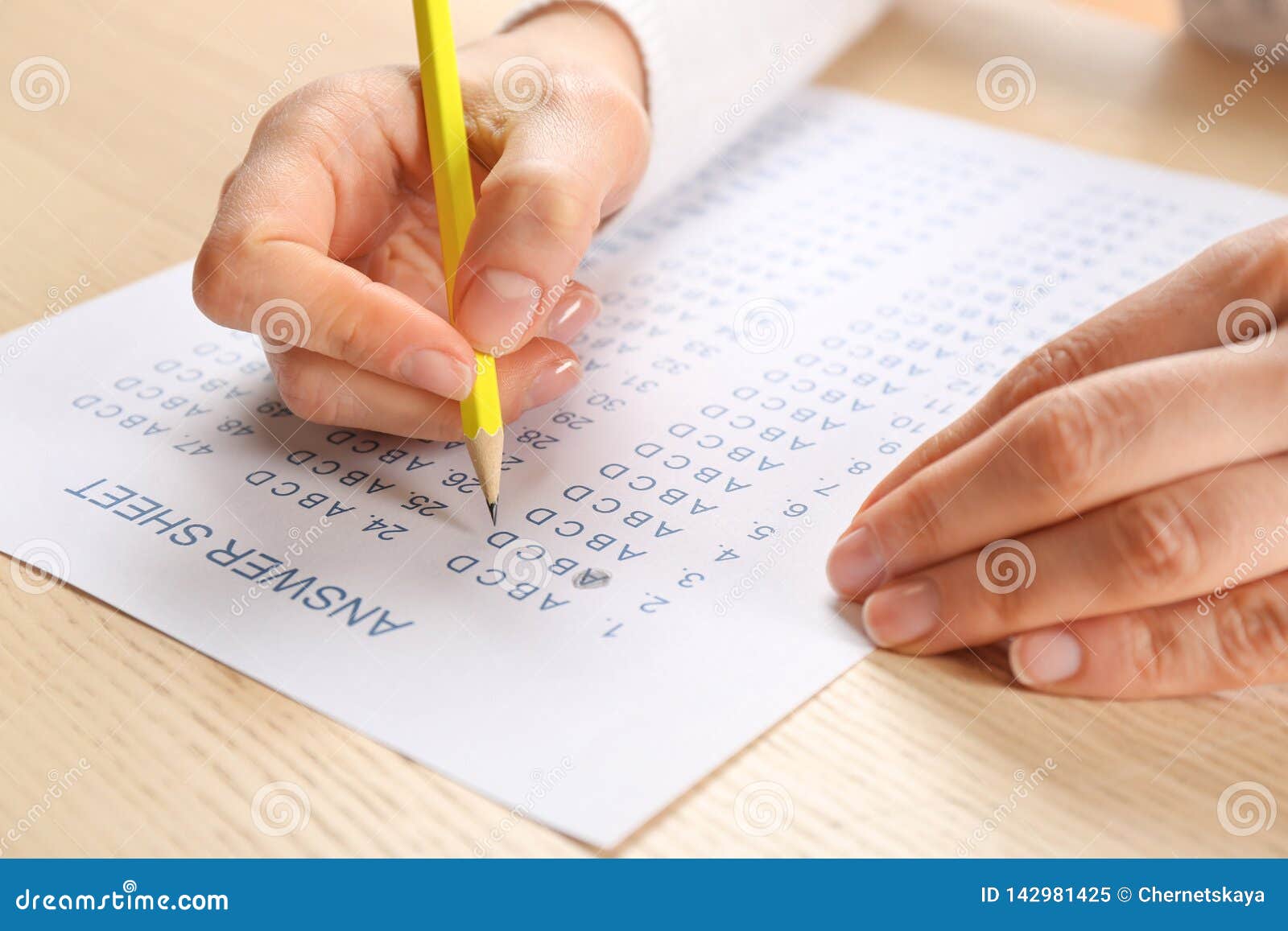 Student Filling Answer Sheet At Table Stock Photography | CartoonDealer ...