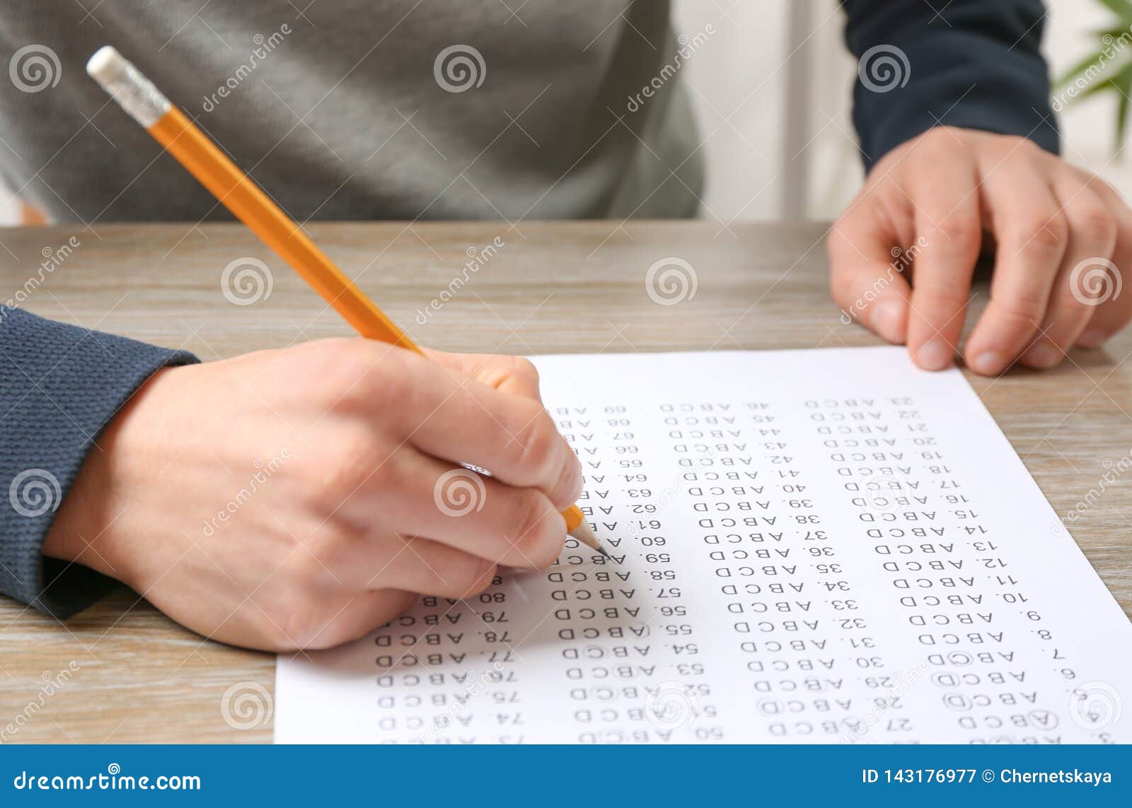 Student Filling Answer Sheet at Table Stock Image - Image of learning ...