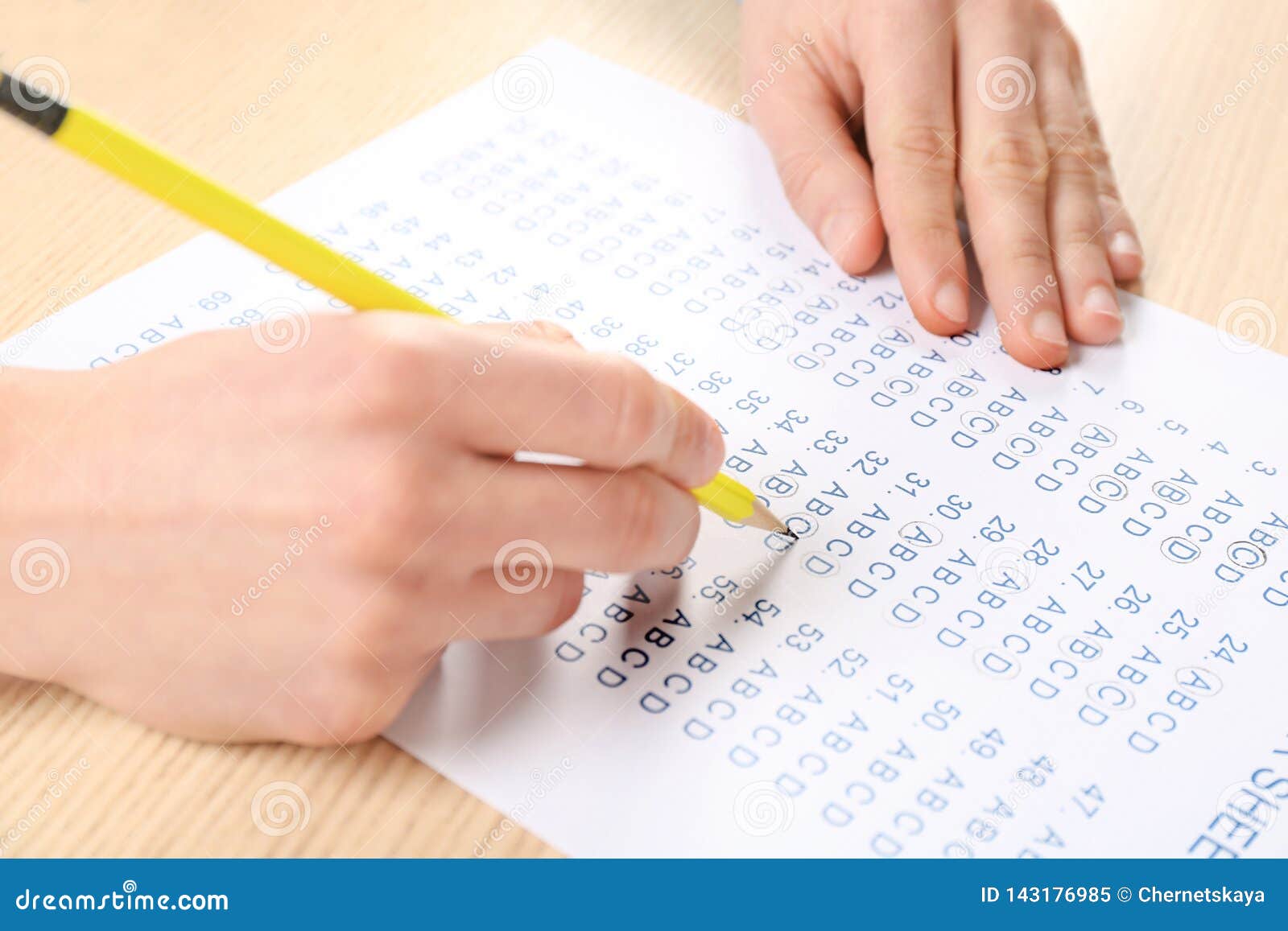 Student Filling Answer Sheet at Table Stock Image - Image of lesson ...