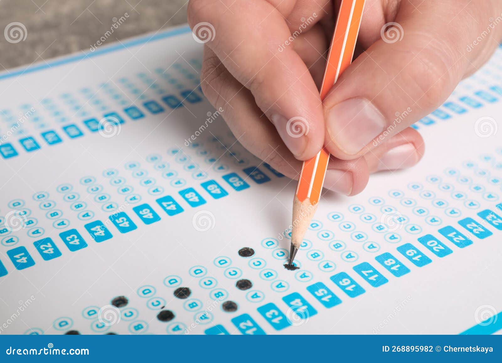 Student Filling Answer Sheet at Table, Closeup. Passing Exam Stock ...
