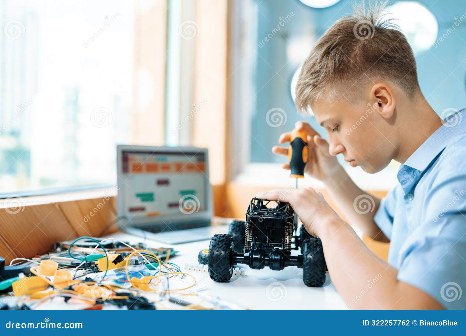Student Fixing Robotics Vehicle Learn Technology in STEM Class ...