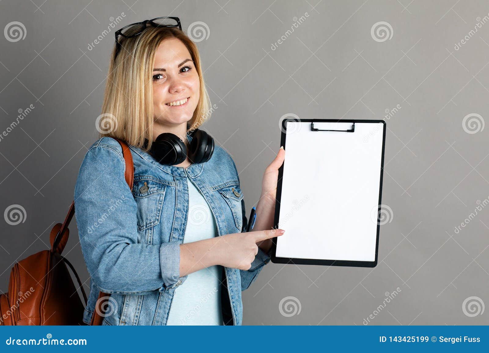 A Student with a Folder for Writing. on a Gray Background Stock Image ...