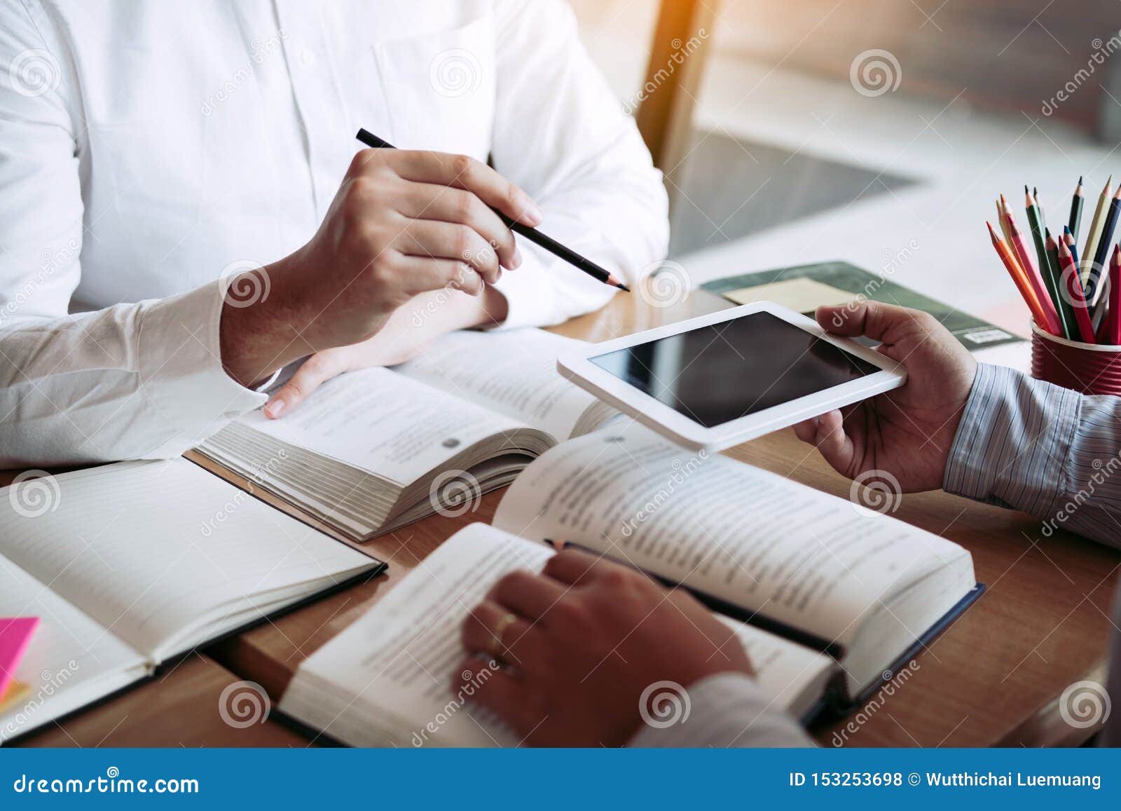 Student Friends are Using Tablets Searching for Information about ...