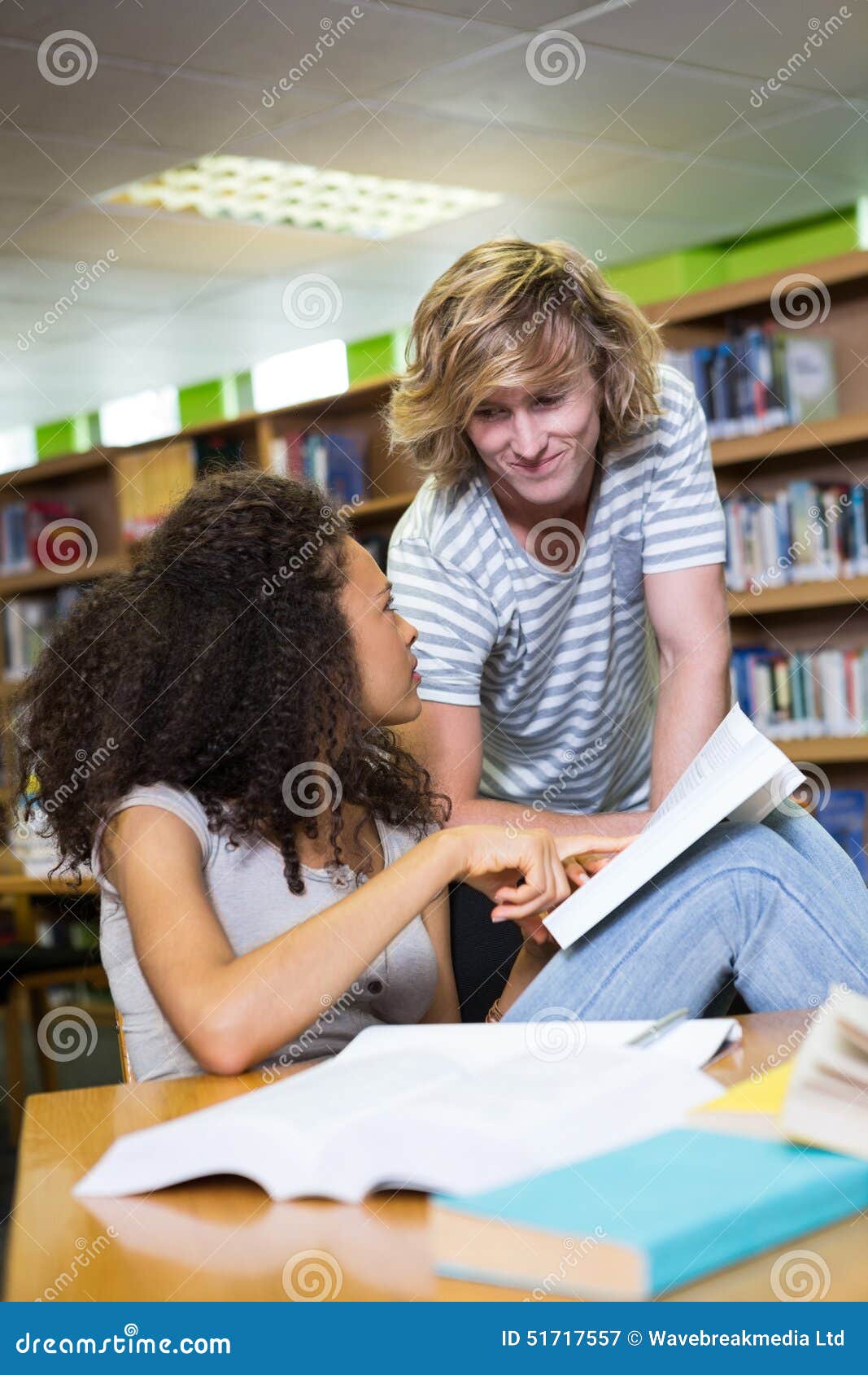 Student Getting Help from Classmate in Library Stock Image - Image of ...