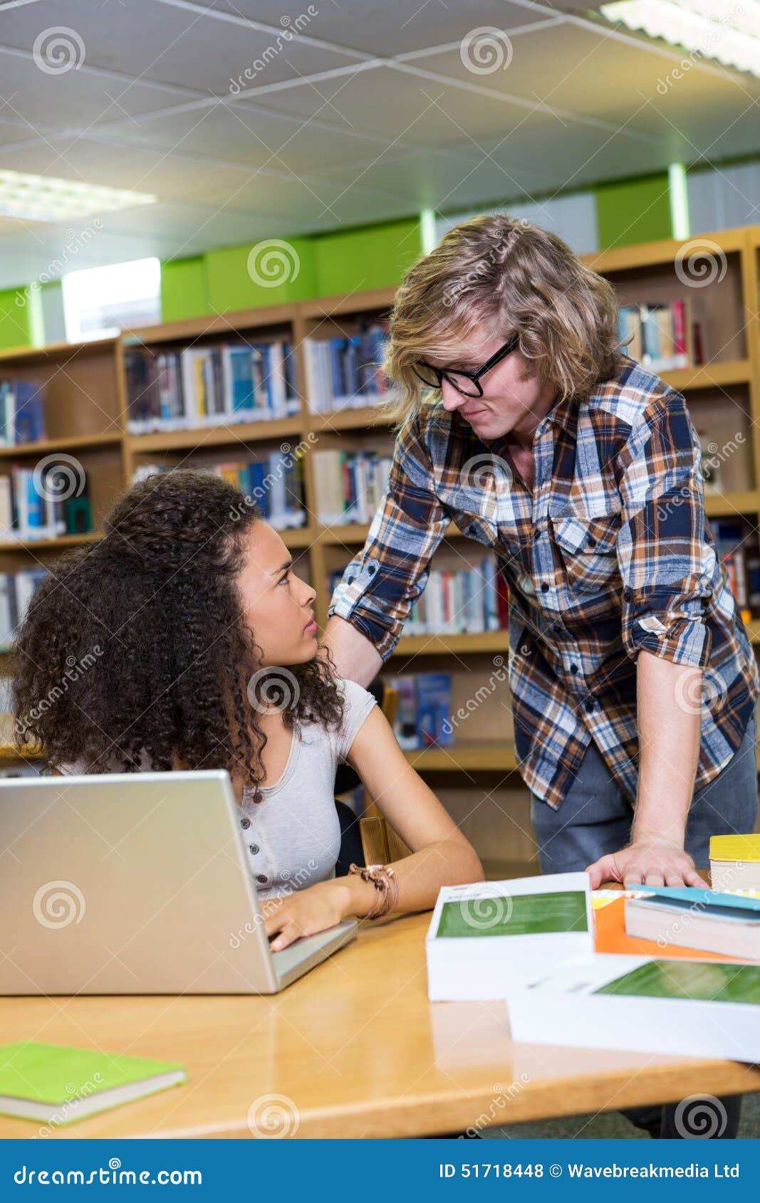 Student Getting Help from Classmate in Library Stock Photo - Image of ...