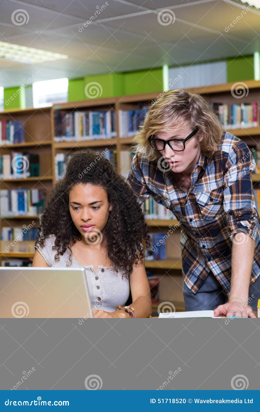 Student Getting Help from Classmate in Library Stock Photo - Image of ...
