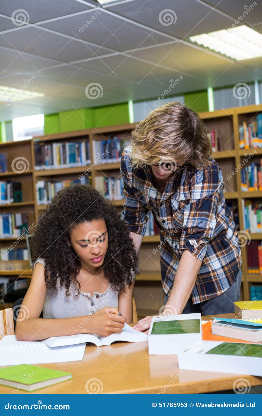 Student Getting Help from Classmate in Library Stock Image - Image of ...