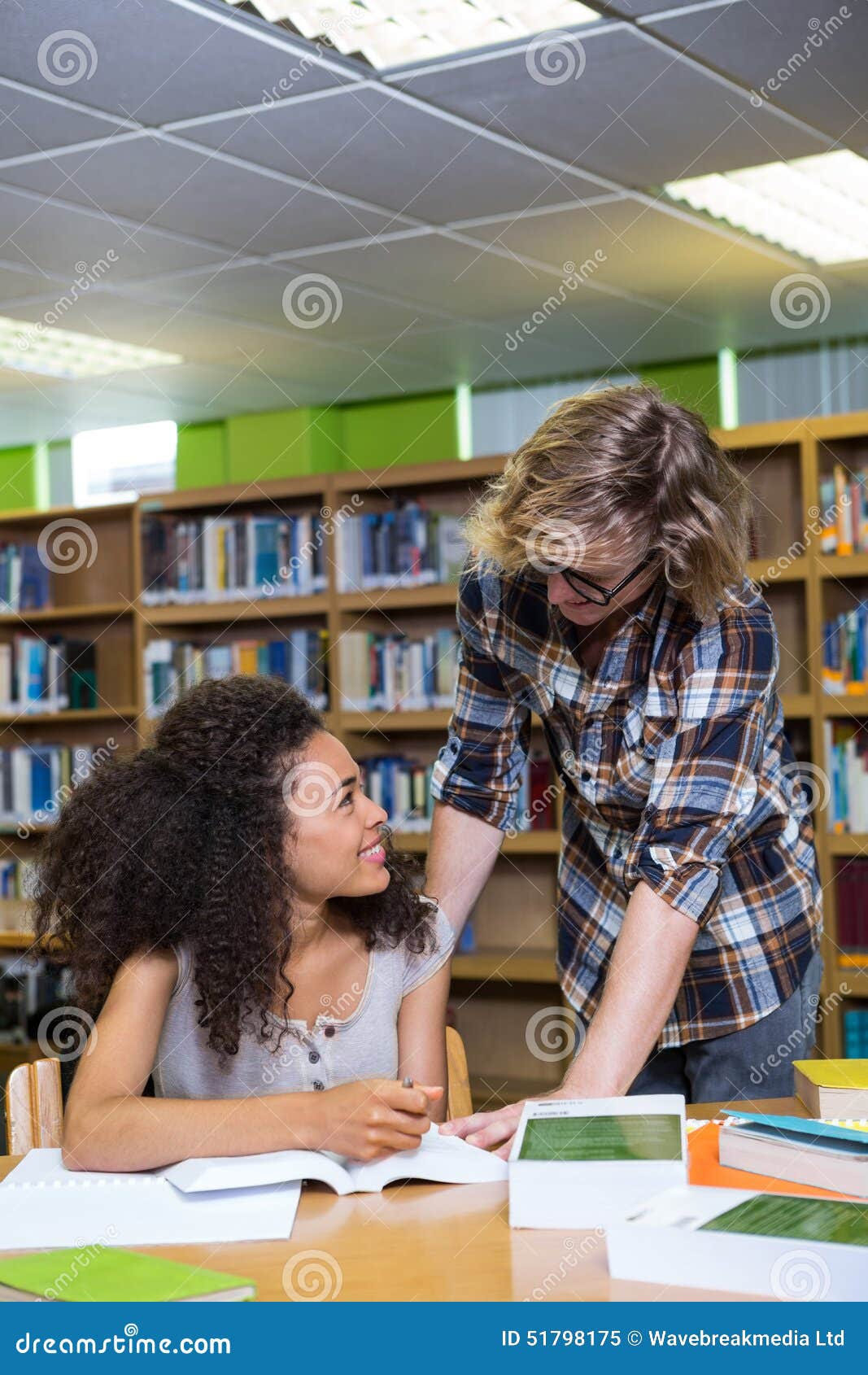 Student Getting Help from Classmate in Library Stock Image - Image of ...