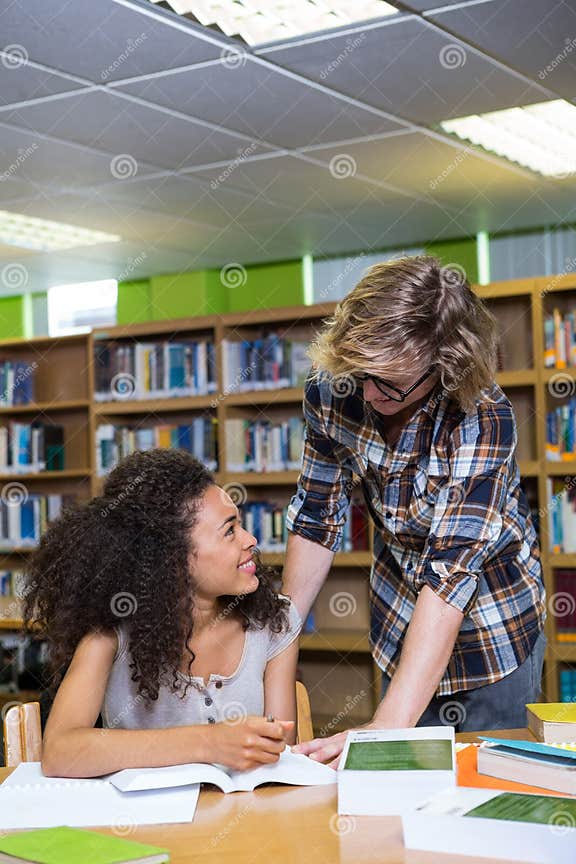 Student Getting Help from Classmate in Library Stock Image - Image of ...