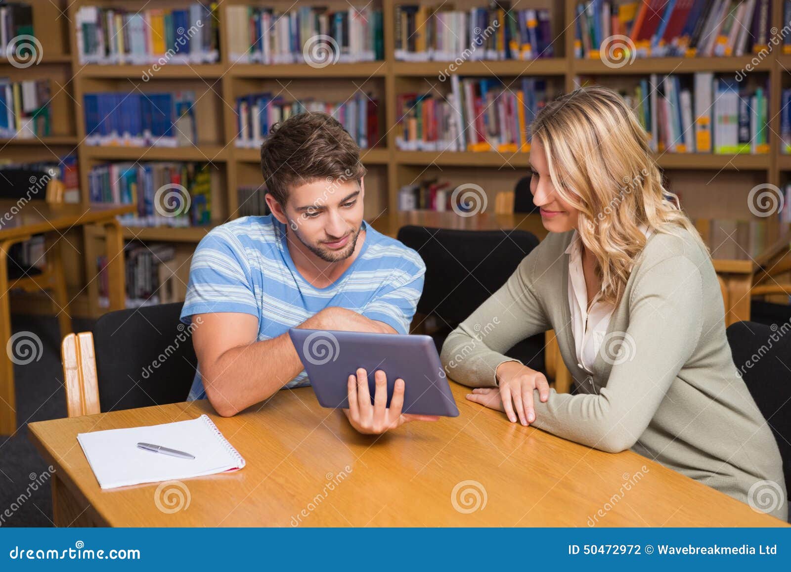 Student Getting Help from Tutor in Library Stock Photo - Image of ...