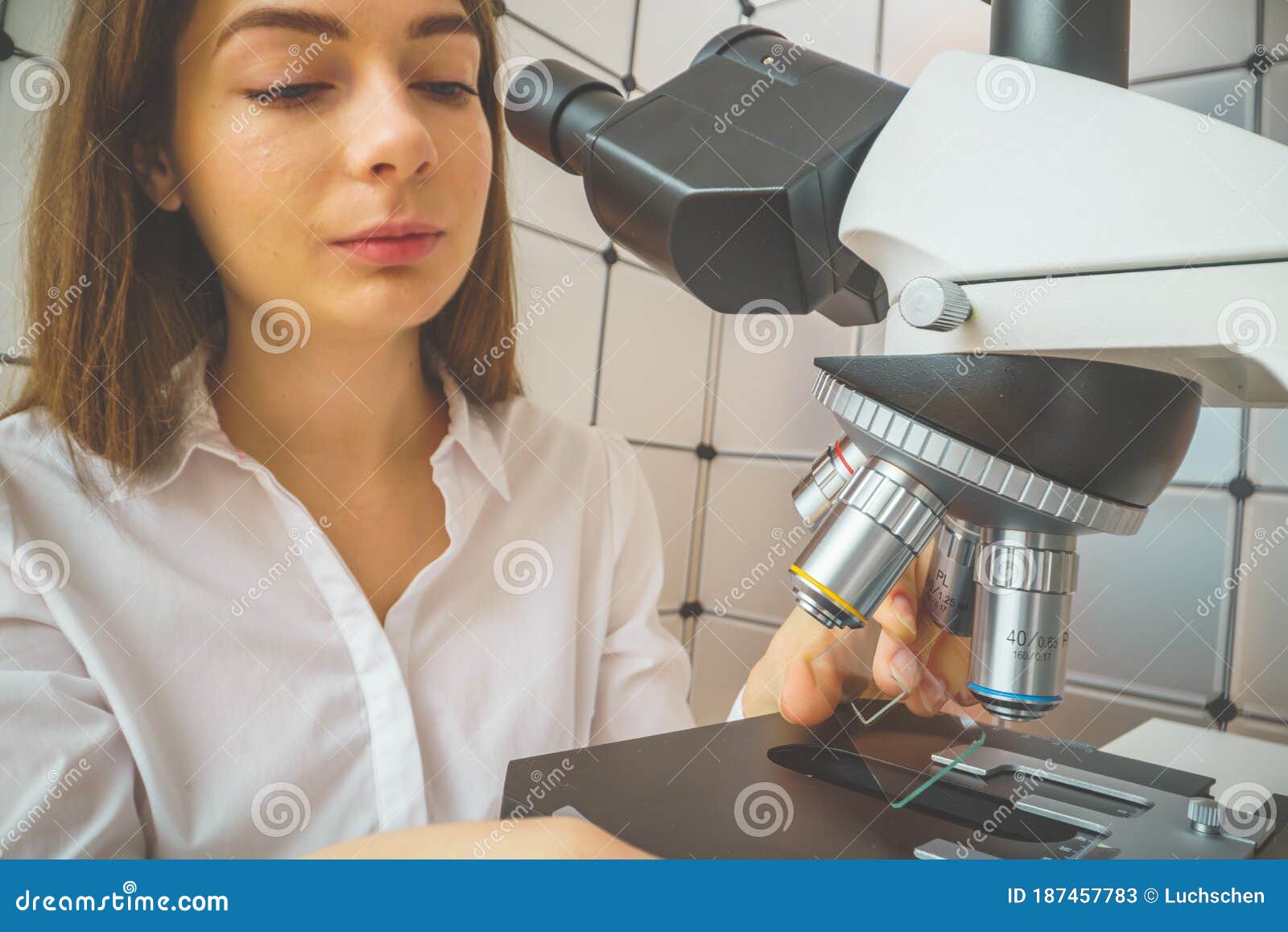 Student Girl Looking in a Microscope, Science Laboratory Concept Stock ...
