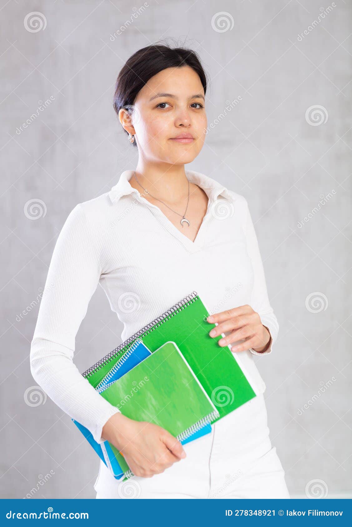 Student Girl with Several Notebooks for Writing Poses in Studio. Stock ...