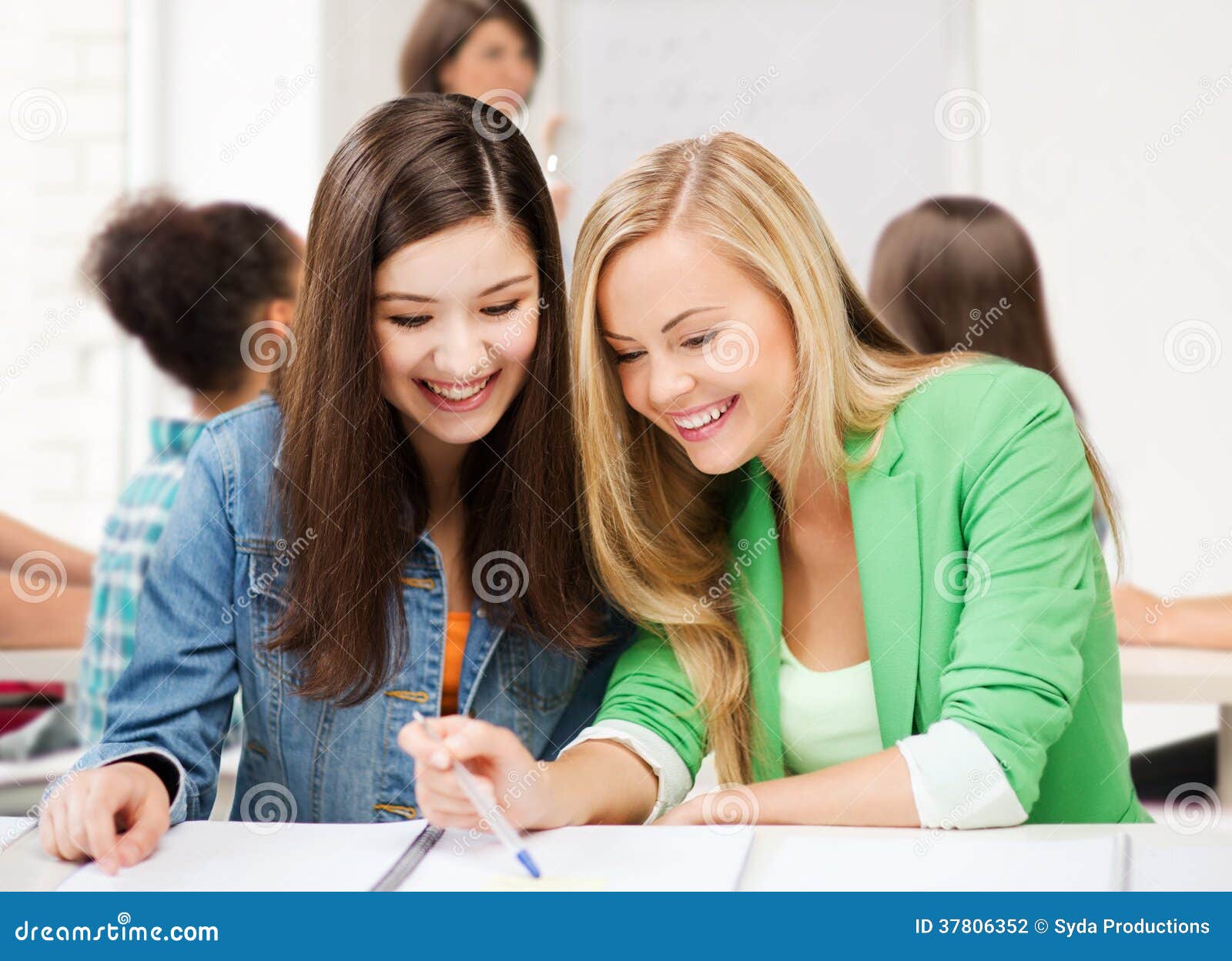 Student Girls Pointing at Notebook at School Stock Photo - Image of ...