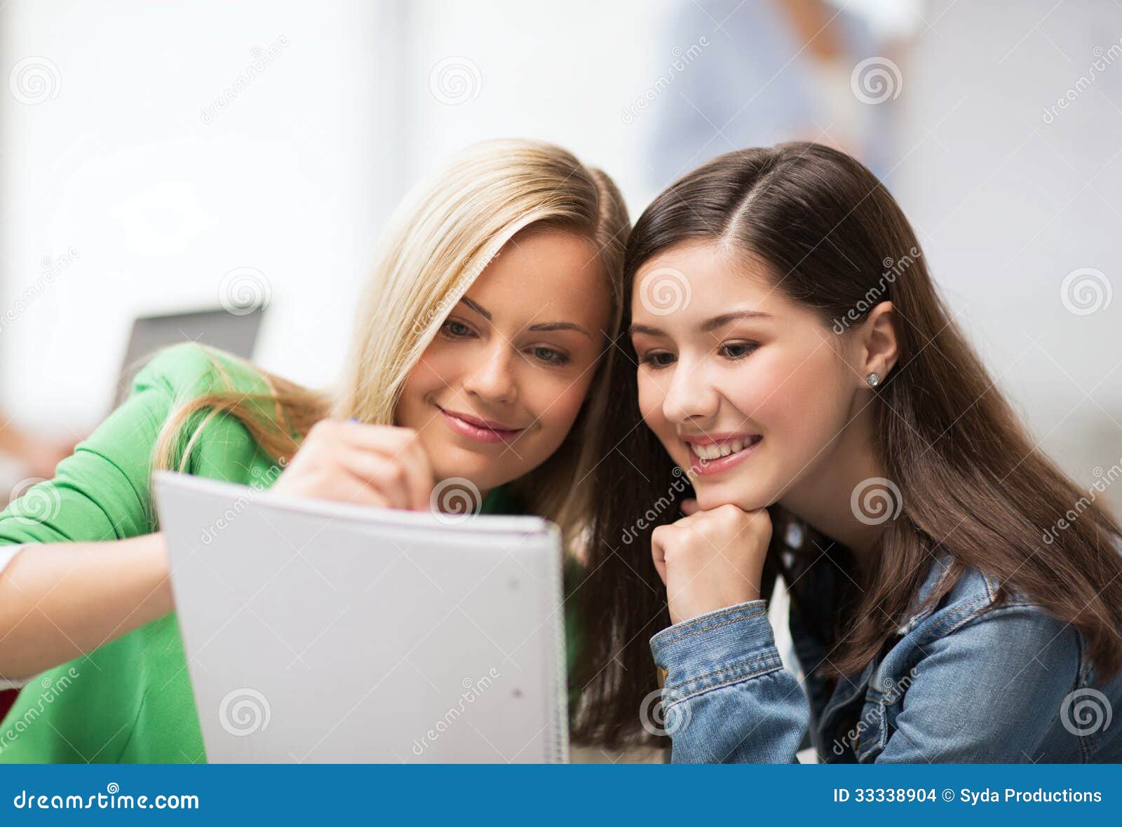 Student Girls Pointing at Notebook at School Stock Photo - Image of ...