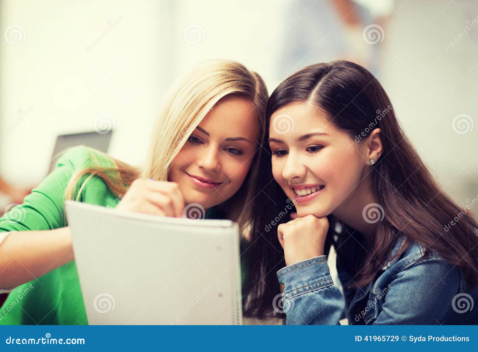 Student Girls Pointing at Notebook at School Stock Image - Image of ...